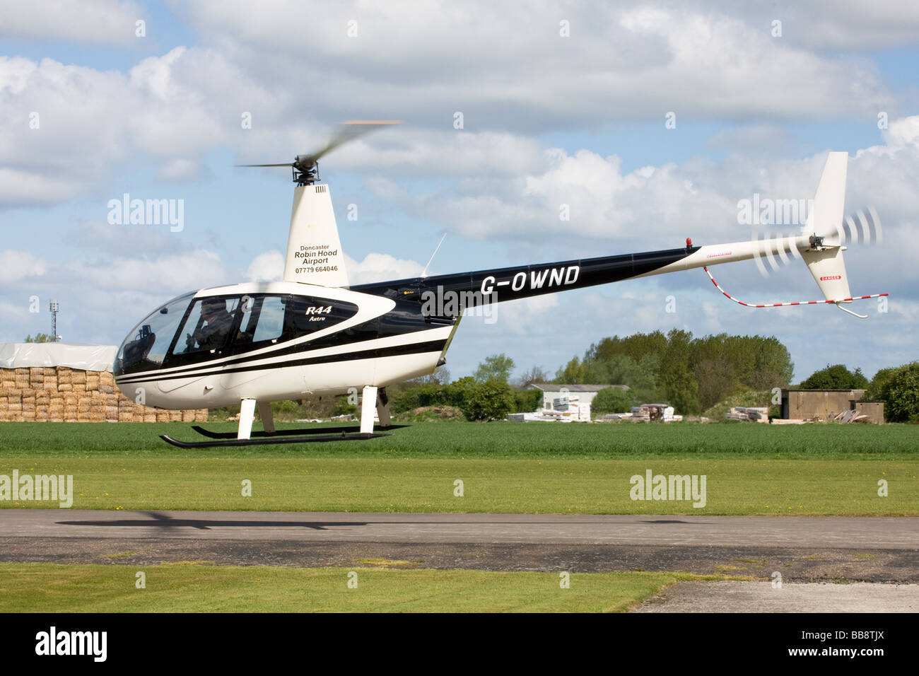 Robinson R44 Astro G-OWND in flight taking-off at Breighton Airfield ...