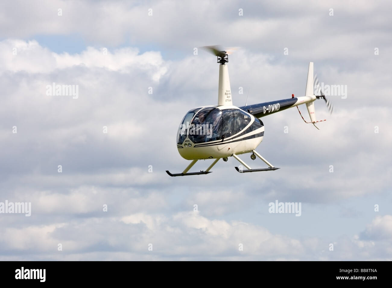 Robinson R44 Astro G-OWND in flight at Breighton Airfield Stock Photo ...