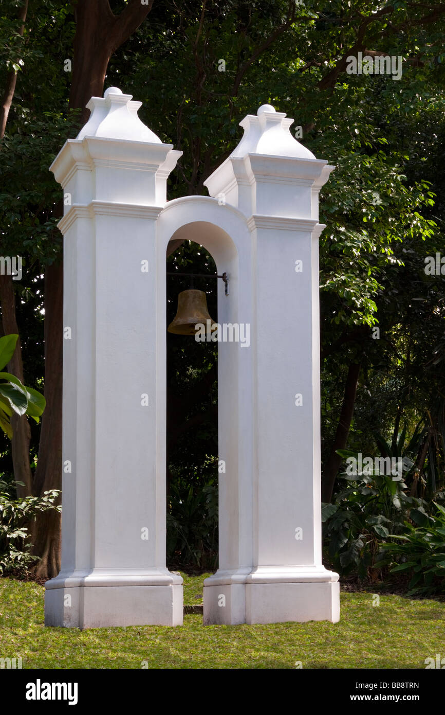 Brass curfew bell mounted between two white pillars. Durban, Kwazulu ...