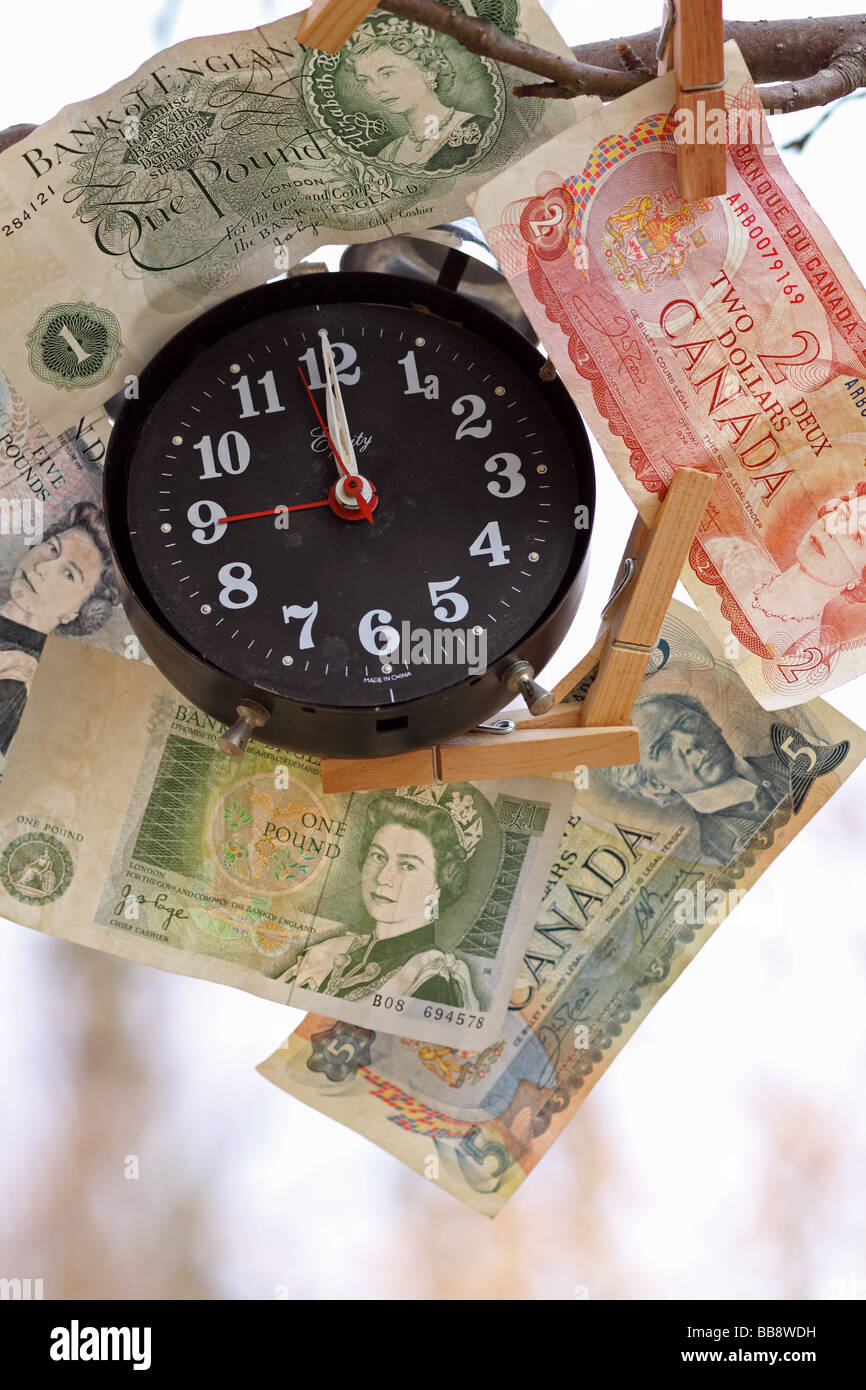 British Canadian money on tree with time Stock Photo - Alamy