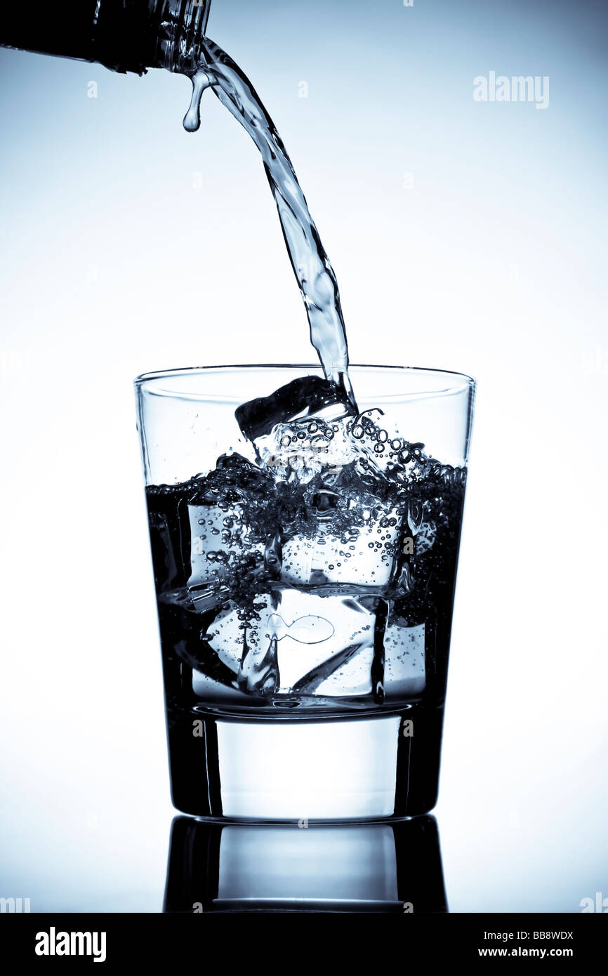 Pouring a Cocktail in blue Stock Photo - Alamy