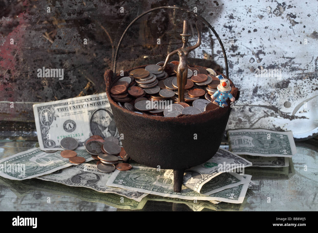 a pot filled with money and an engineer Stock Photo - Alamy