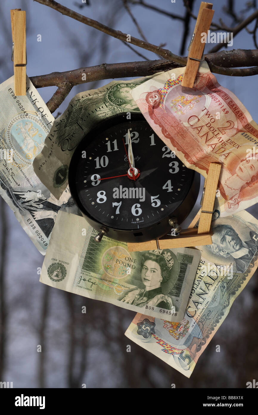 British Canadian money on tree with time Stock Photo - Alamy