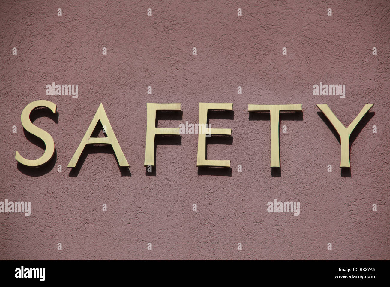 A safety sign on a brown background Stock Photo - Alamy
