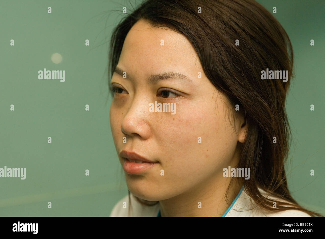 Zhao Yan, 27, a nurse, sits on the operating table after the 20 minute ...
