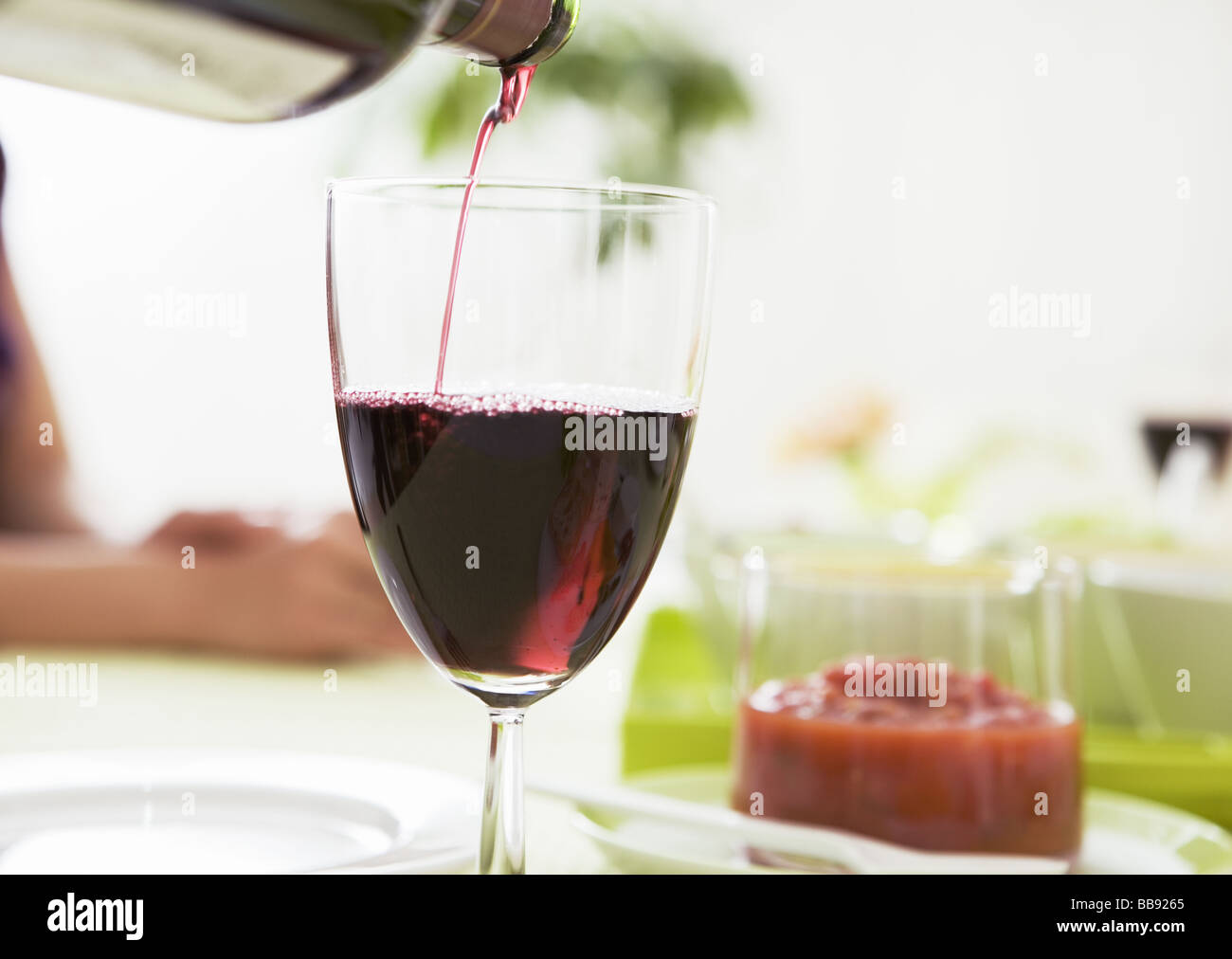 Pouring red wine Stock Photo - Alamy