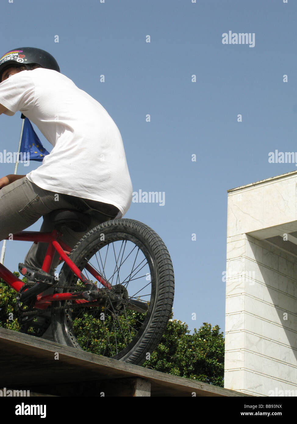 person doing bike stunts on ramp at event outdoors Stock Photo - Alamy