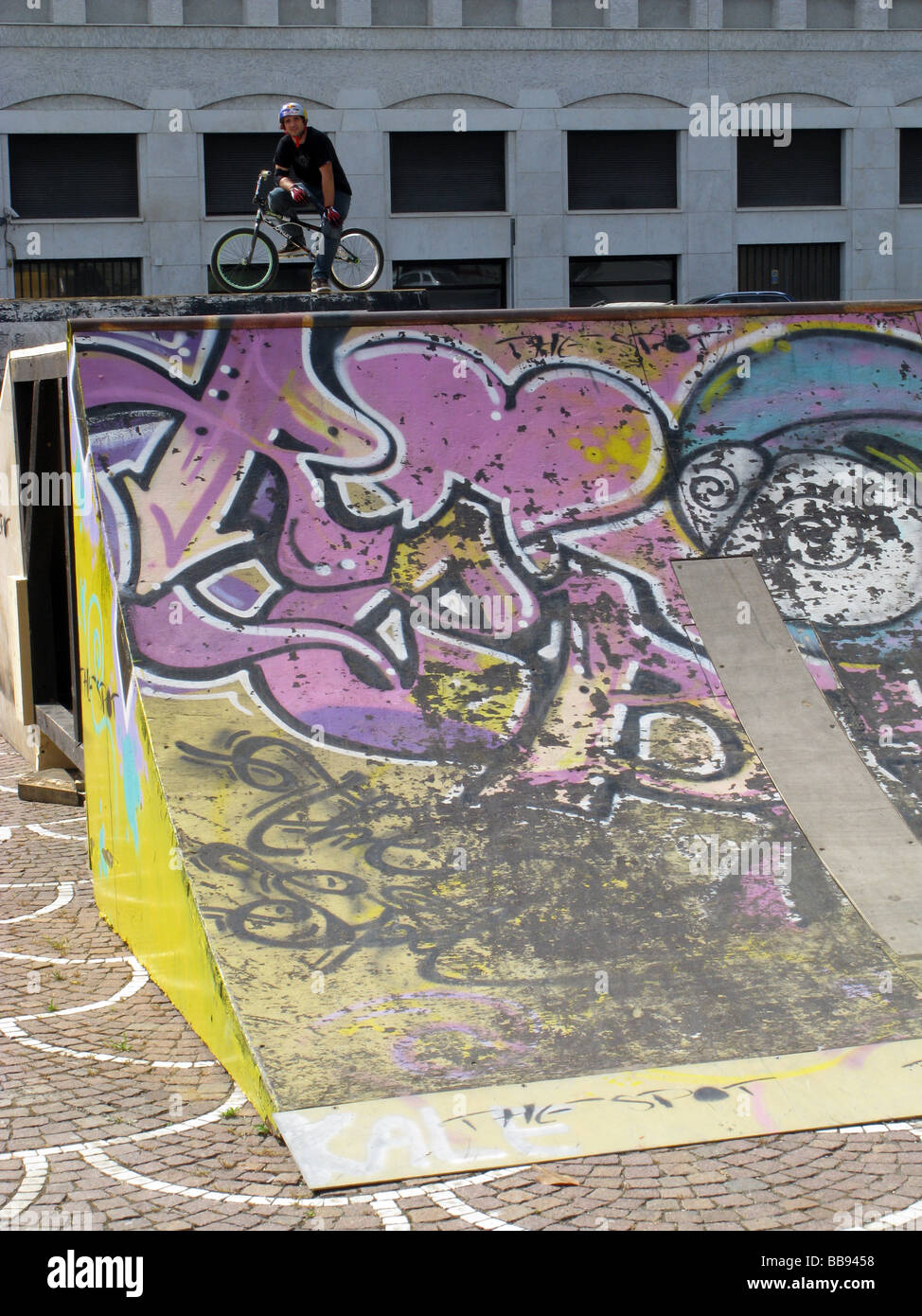 person doing bike stunts on ramp at event outdoors Stock Photo - Alamy