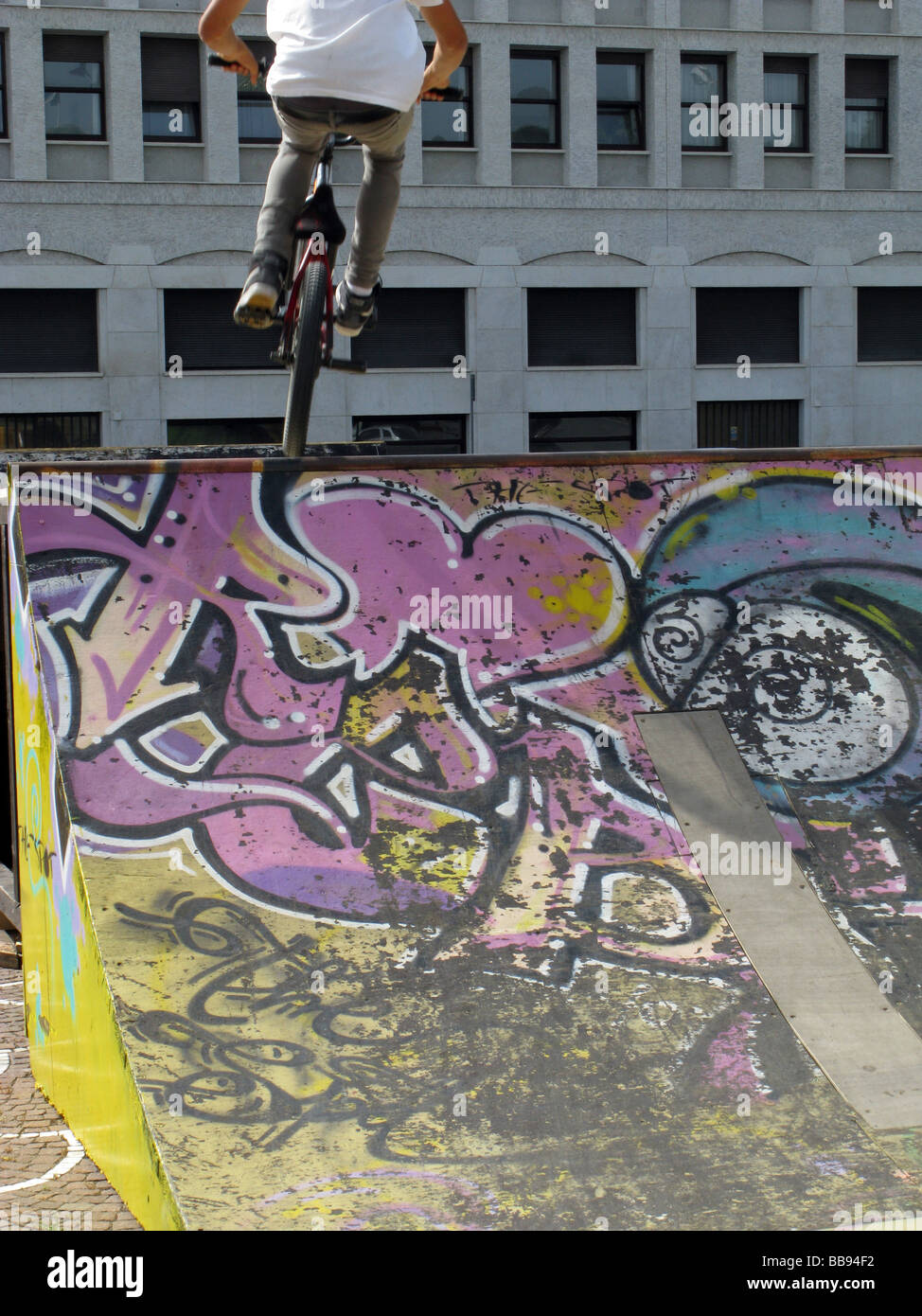 person doing bike stunts on ramp at event outdoors Stock Photo - Alamy