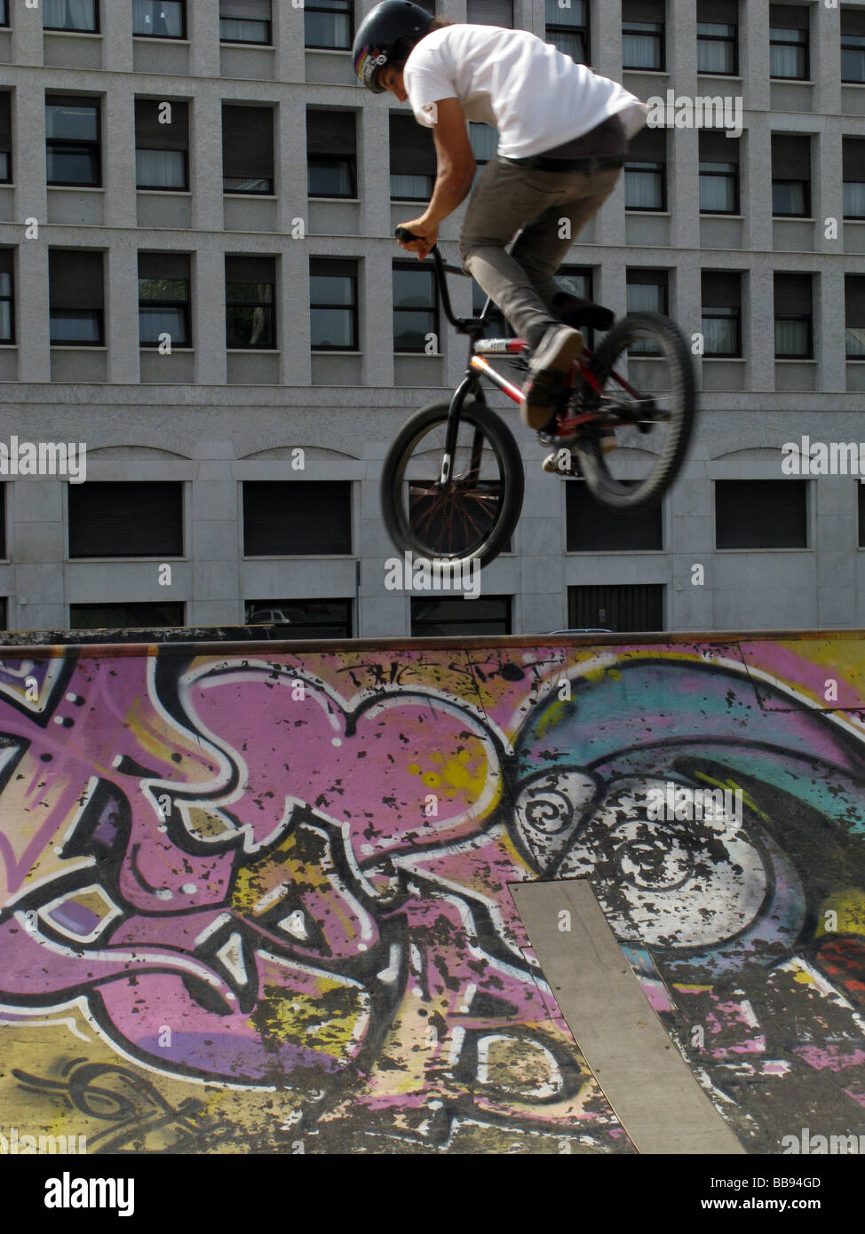 person doing bike stunts on ramp at event outdoors Stock Photo - Alamy