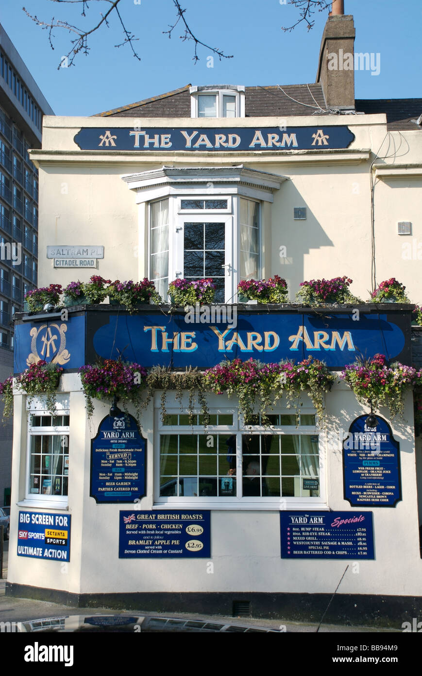 The Yard Arm pub sign with flower display, Plymouth, Devon, UK Stock ...