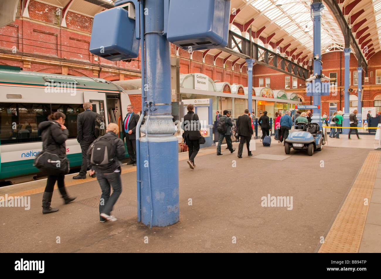 Norwich Rail way station with local train at station disgorging it's ...