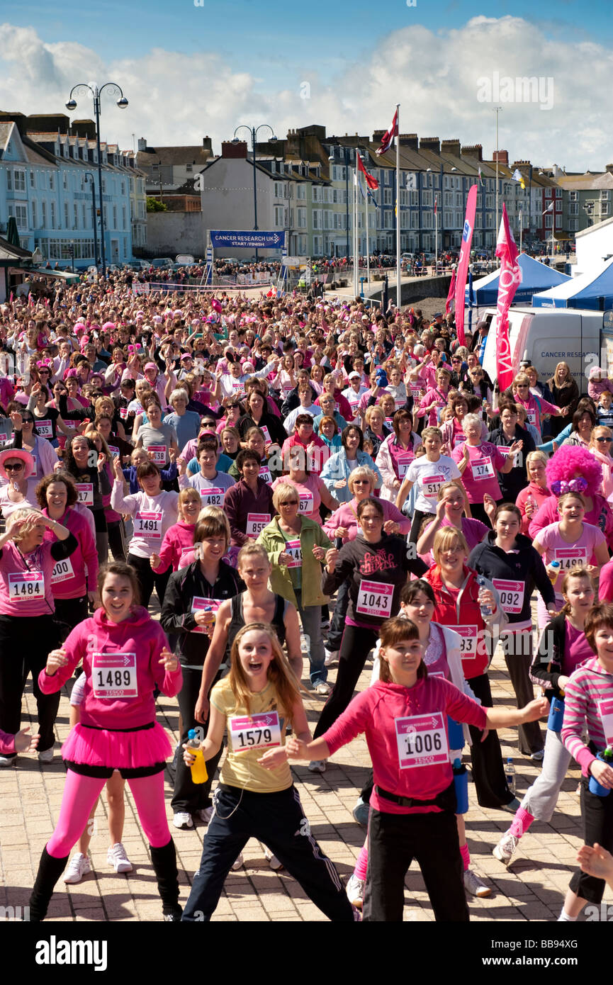 crowd of Women warming up competing in the Race For Life run to raise ...