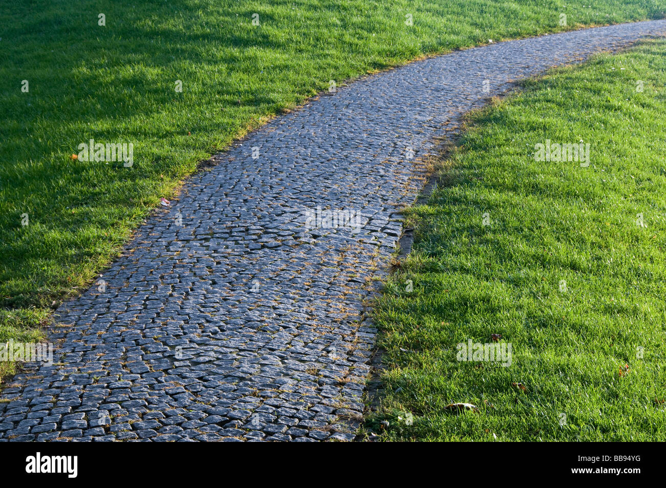 Cobble path and grass Bruges Belgium West Flanders Europe Stock Photo ...