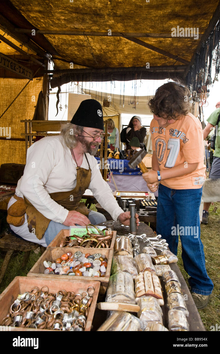 Medieval coin-maker striking coins at Tewkesbury Medival Festival 2008 ...