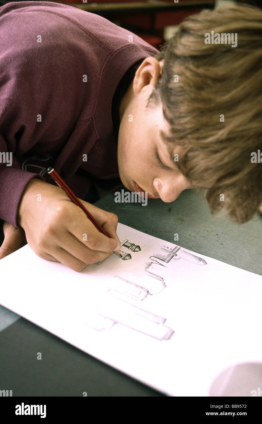 Secondary school boy in art class drawing Stock Photo - Alamy