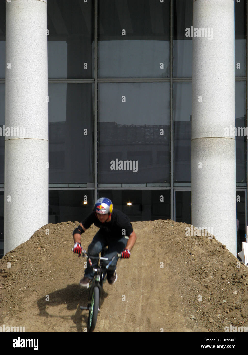 person doing bike stunts on earth ramp at event outdoors in rome italy ...