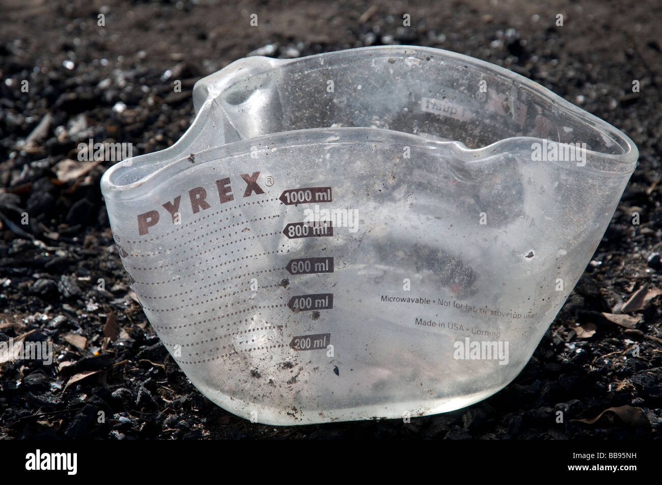 Close up of a pyrex jug distorted by fire Stock Photo - Alamy