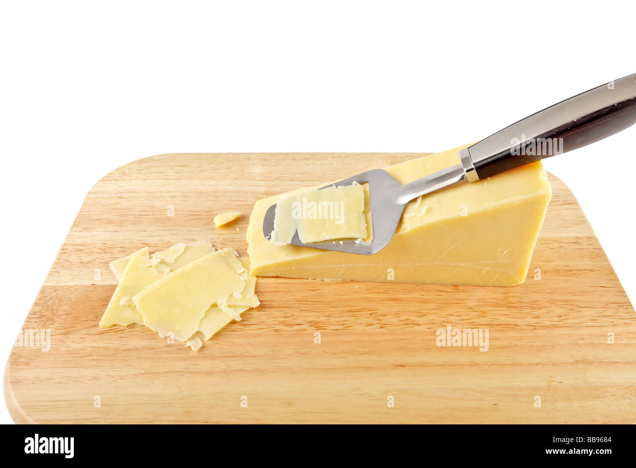 Cheese slice taking slices of cheese from block Stock Photo - Alamy
