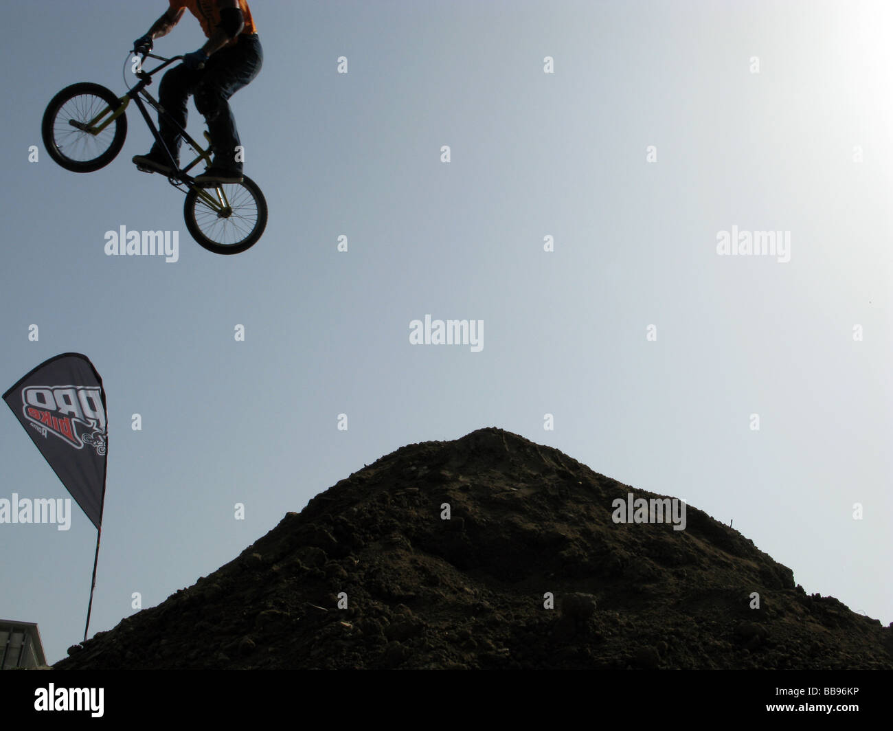 person doing bike stunts on ramp at event outdoors Stock Photo - Alamy