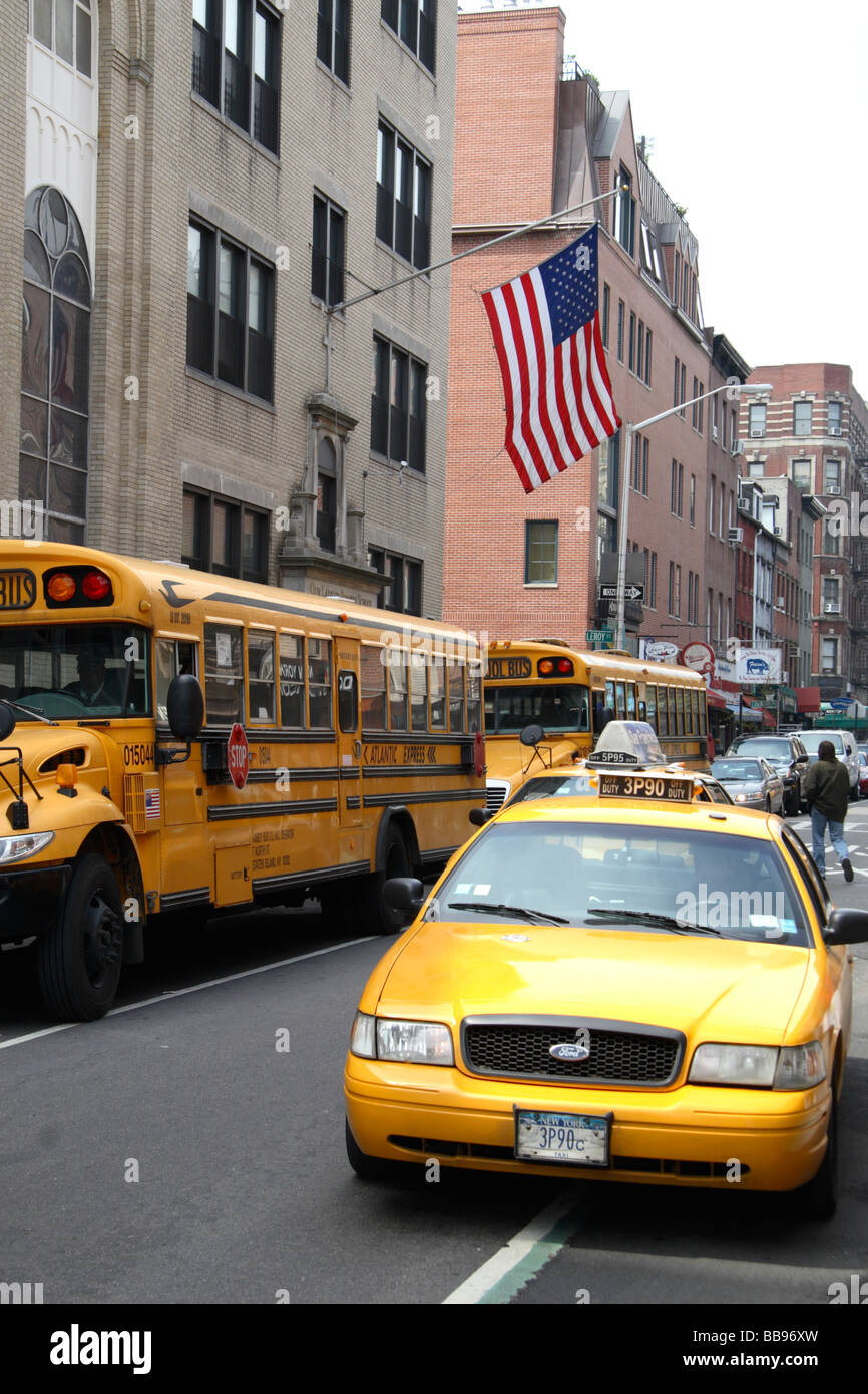 Traditional American yellow school buses & taxi with the star spangled ...