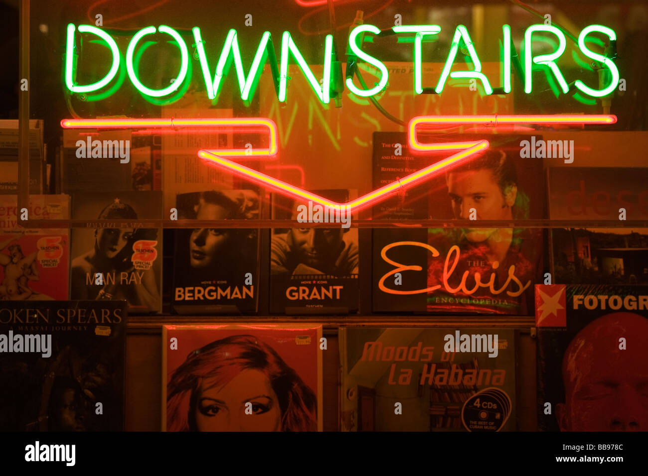 Abstract Downstairs Neon Sign with Arrow Stock Photo - Alamy