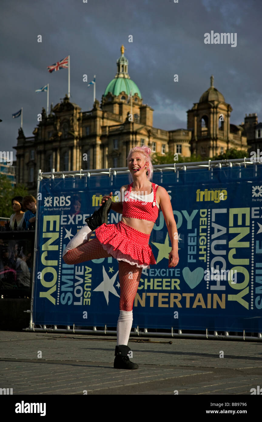 Female Street Performer entertains audience at Mound Edinburgh ...
