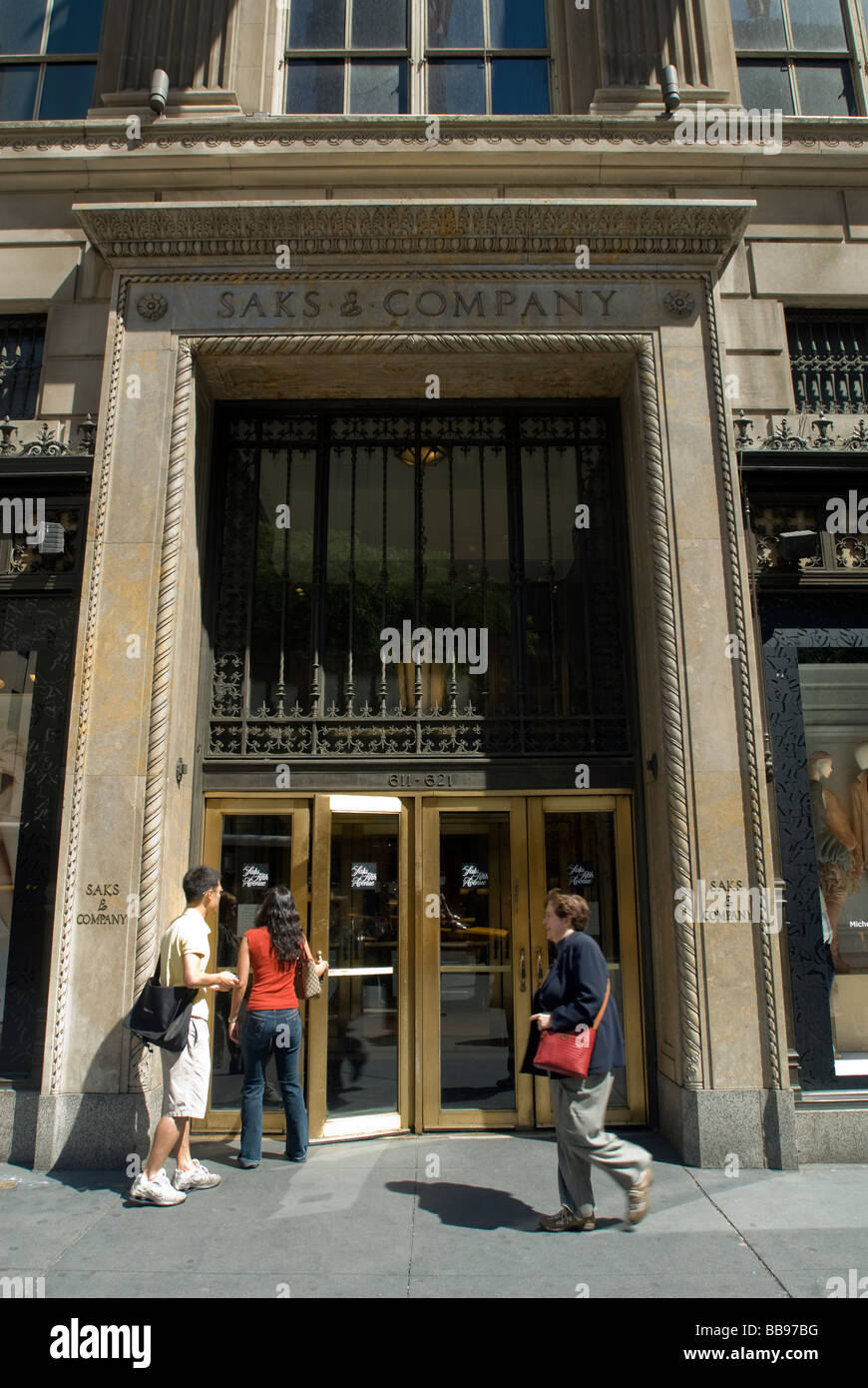 Shoppers outside of Saks Fifth Avenue in New York Stock Photo - Alamy