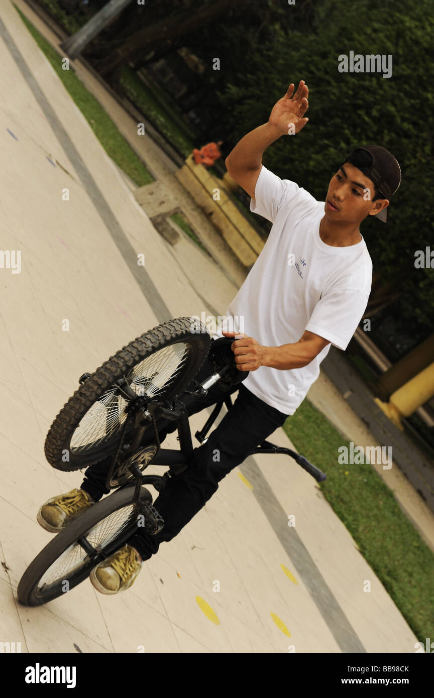 Vietnamese boy raise bicycle wheel at Lenin park, Hanoi, vietnam Stock ...