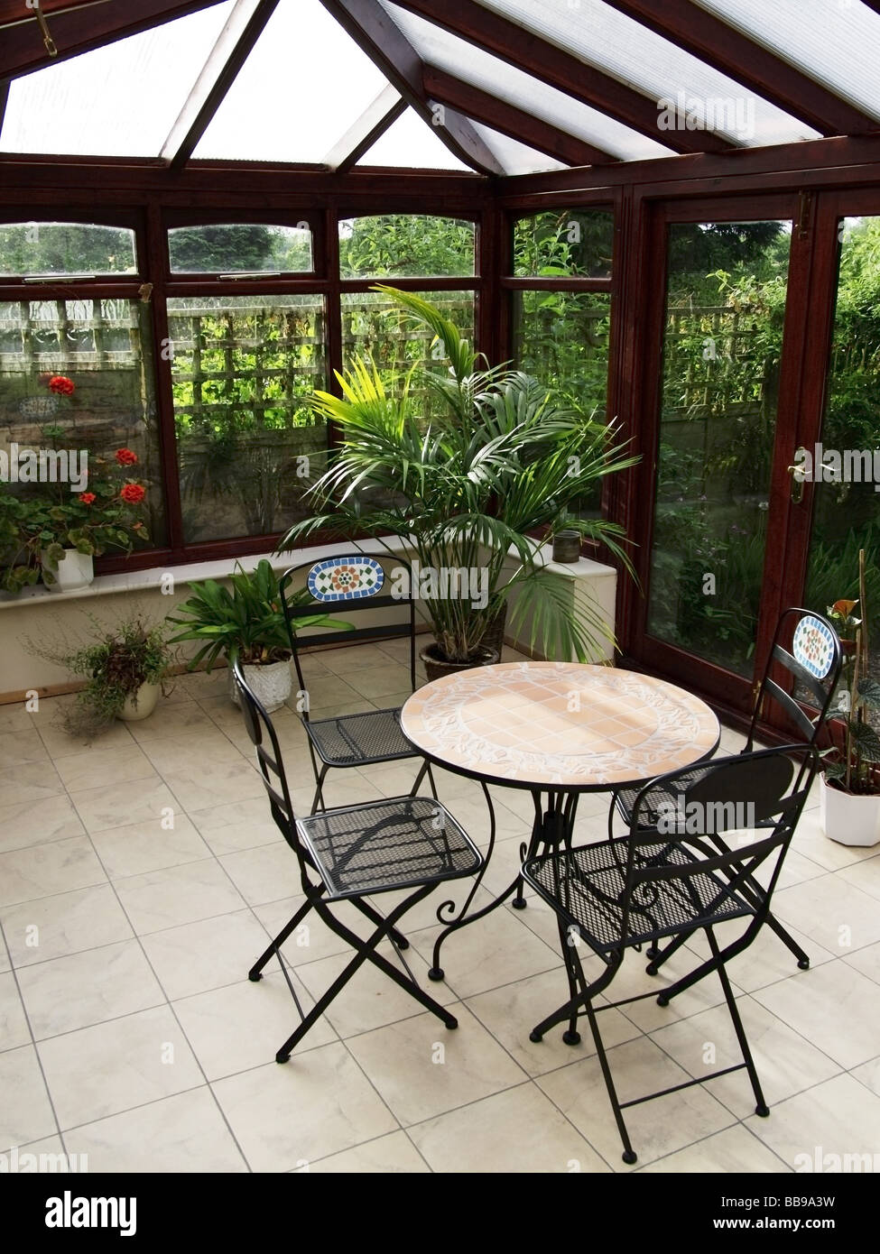 conservatory tables chairs home interior Stock Photo - Alamy