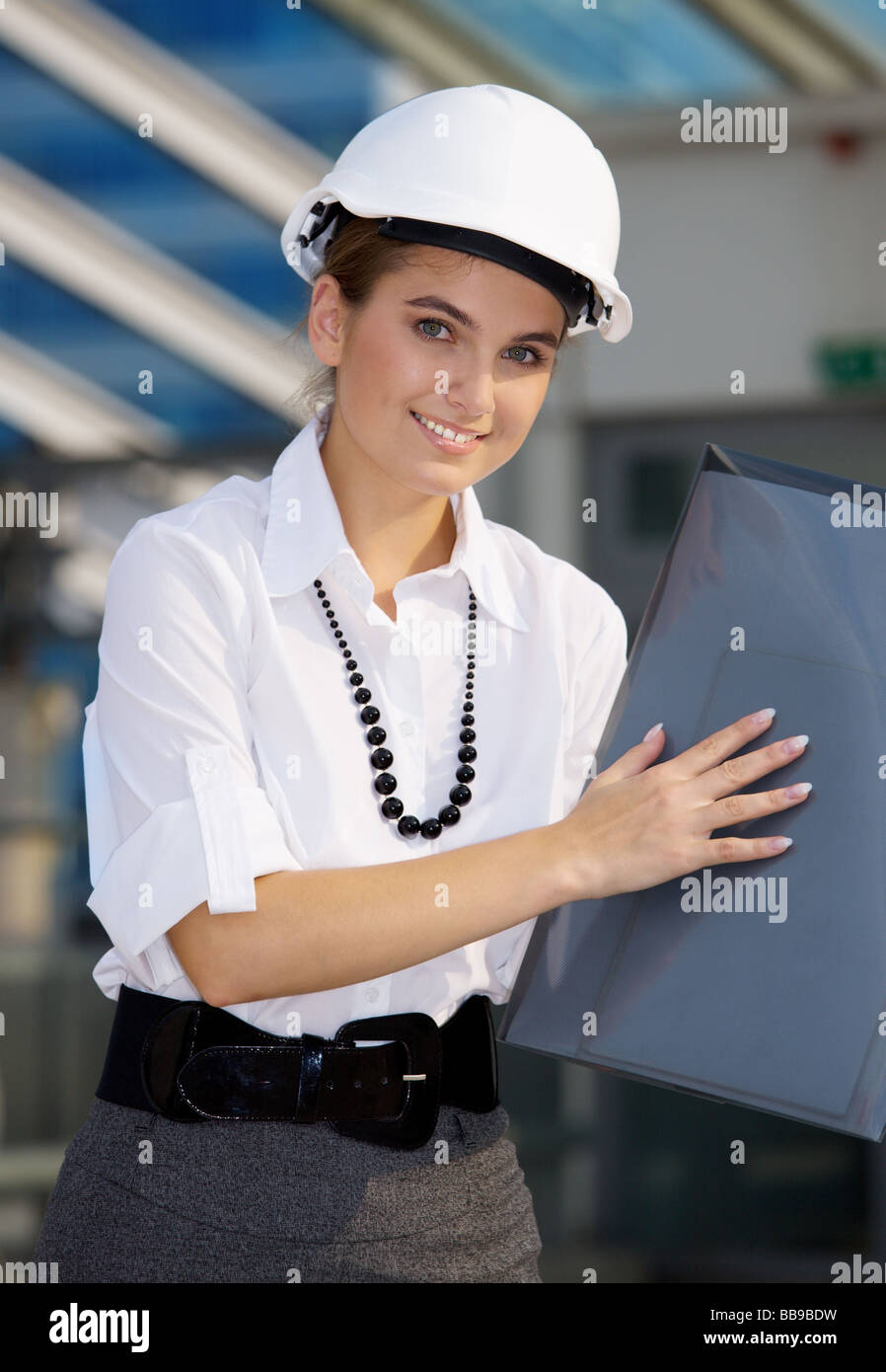 happy contractor in a front of building site Stock Photo - Alamy