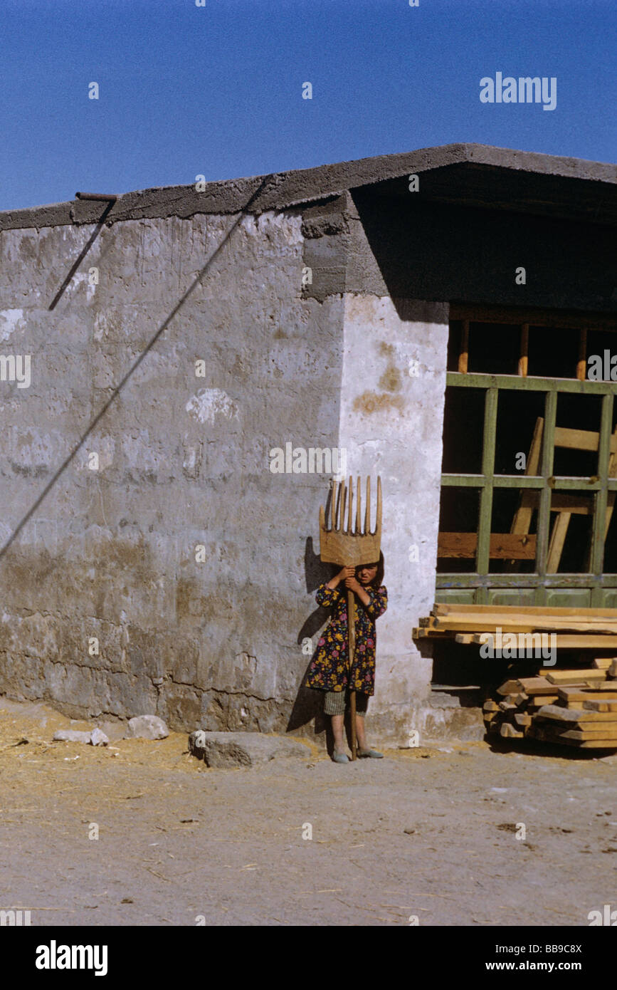 Little girl with a pitchfork Derinkuyu Turkey 670903 007b Stock Photo ...