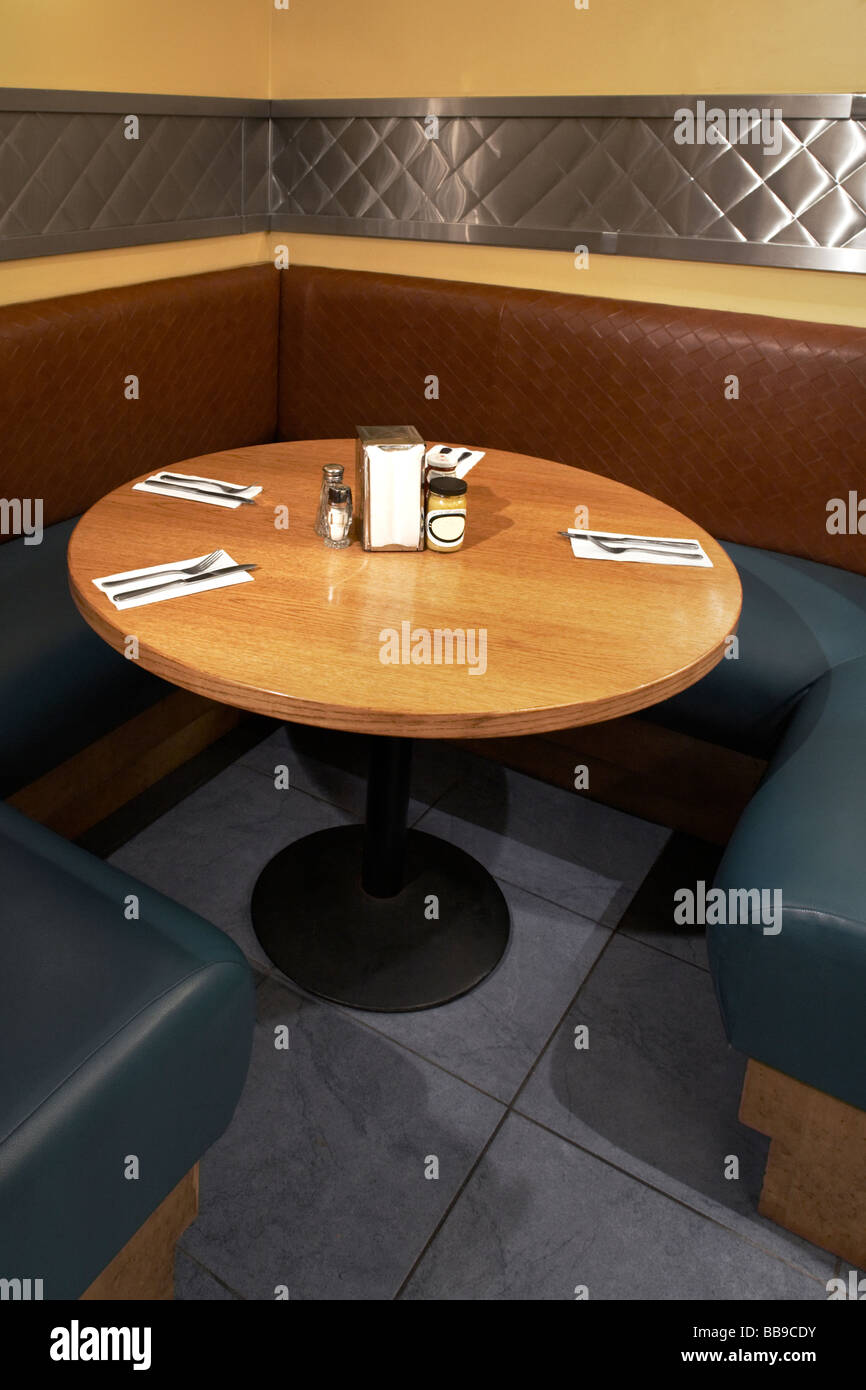 Round wood dining table Stock Photo - Alamy