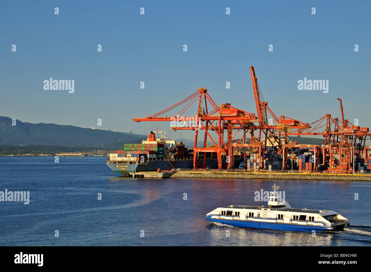 The Seabus passes by the Container teminal Port of Vancouver British ...