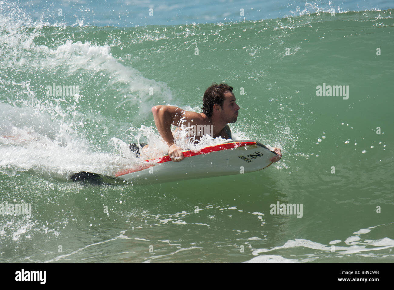 Bodyboarding at Estaleiro Beach Stock Photo - Alamy