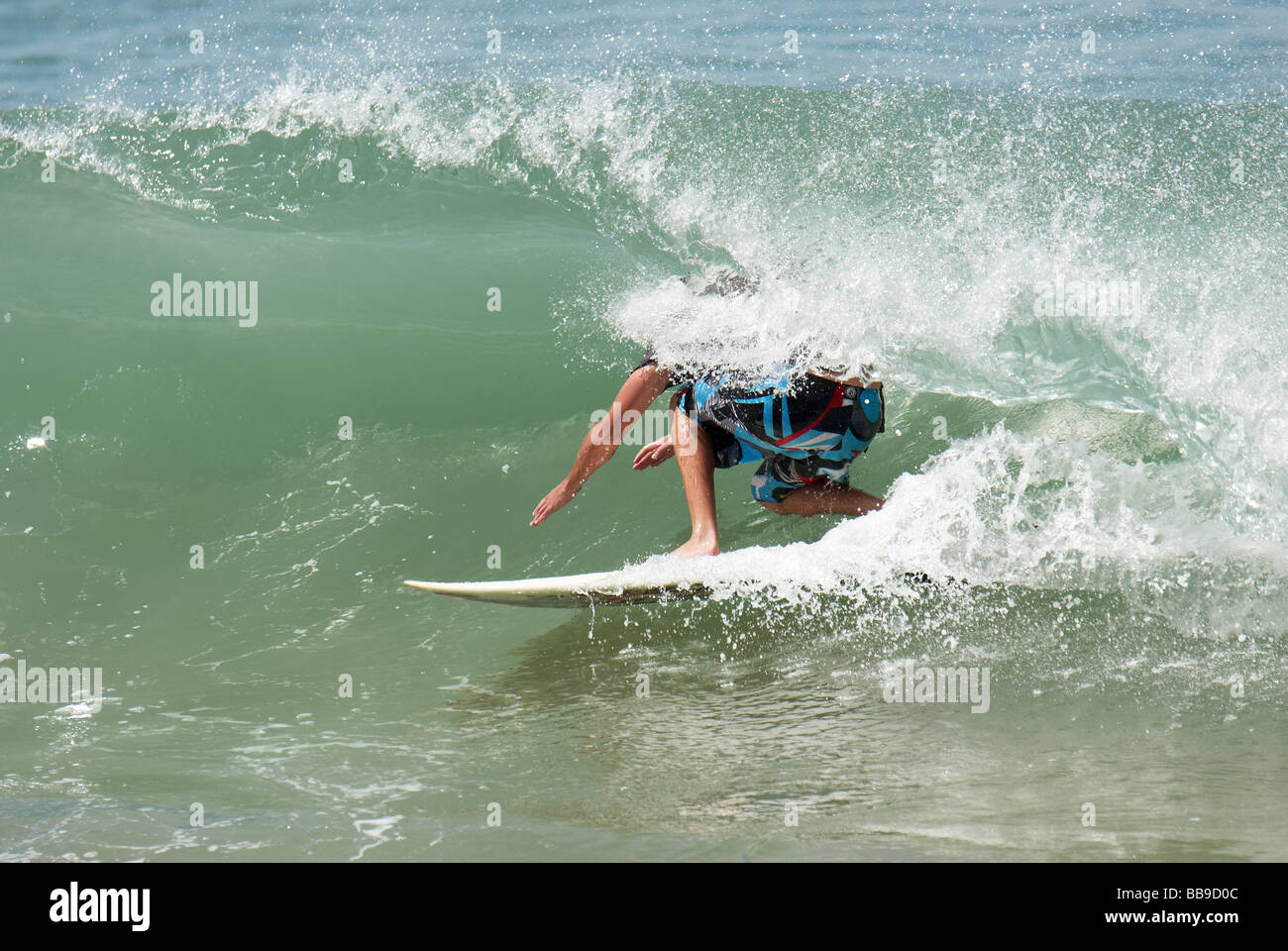 Surfing in the tube Stock Photo - Alamy