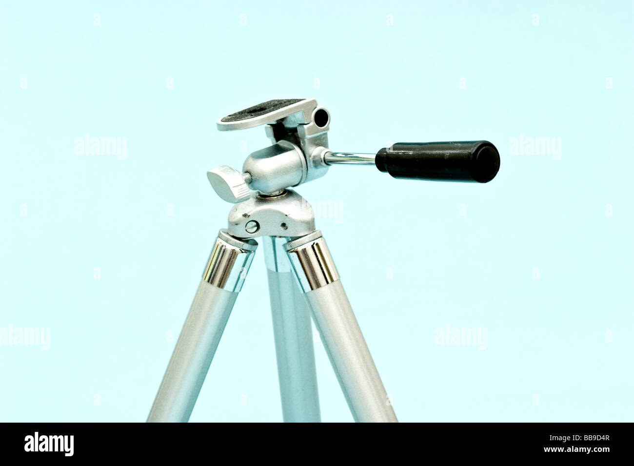 Small silver camera tripod Stock Photo - Alamy