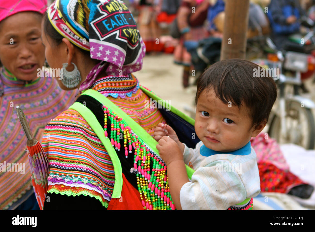 Mother flower hmong with baby on her back Stock Photo - Alamy