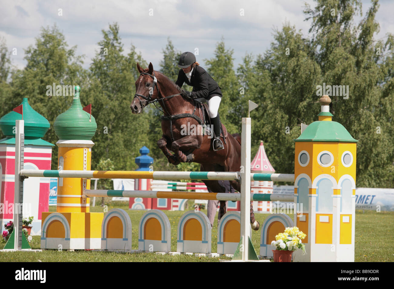 Black horse rider jumping over hi-res stock photography and images - Alamy