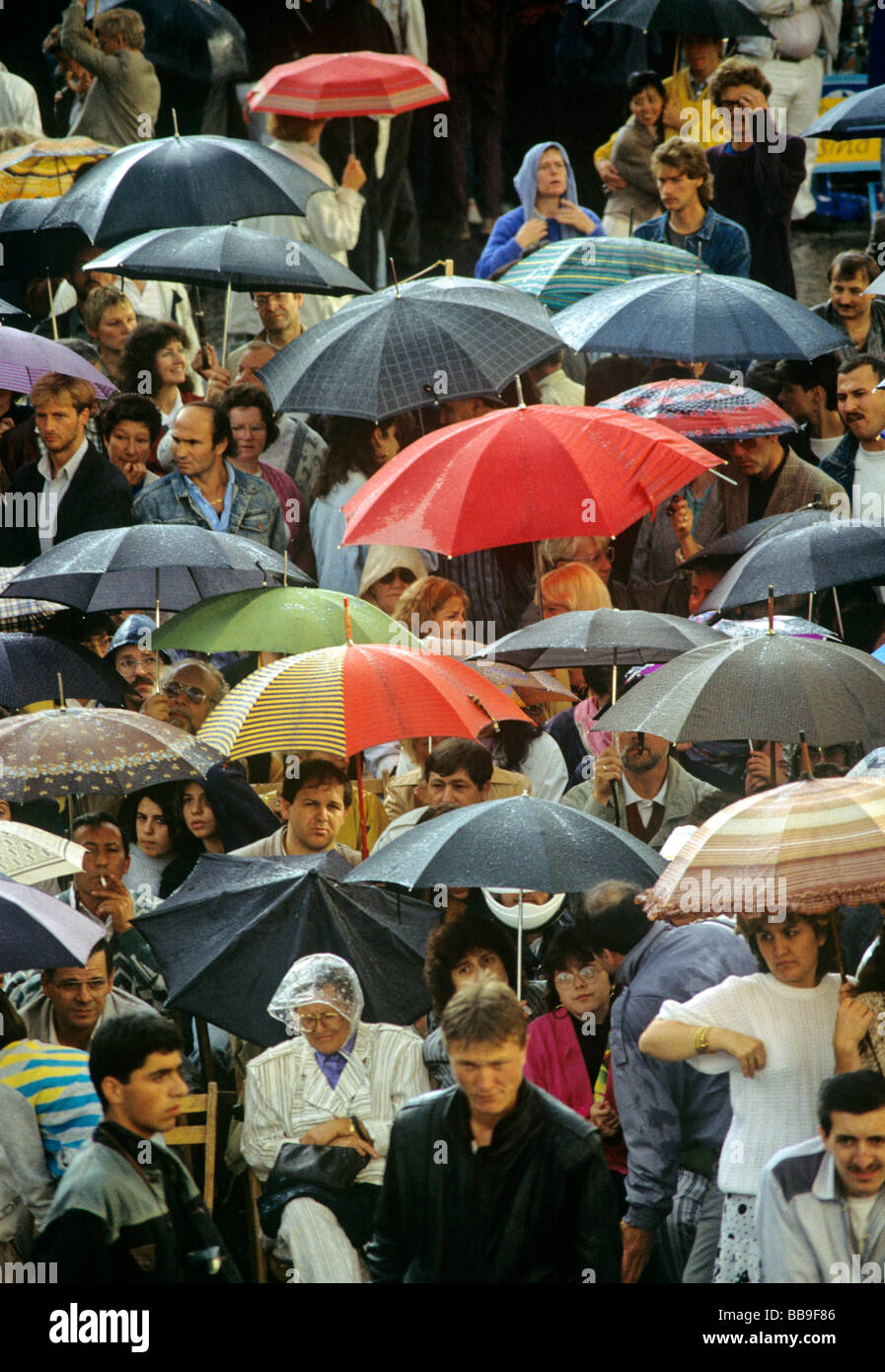 umbrellas and crowd in shower Stock Photo - Alamy