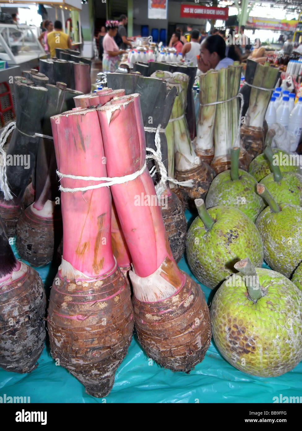 Breadfruit and pink taro in the market, La Merche, Papeete, Tahiti. No ...