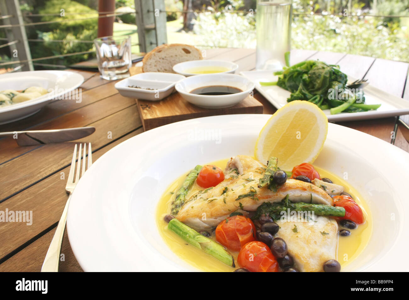 Grilled Fish Meal in an Outdoor Restaurant Stock Photo - Alamy