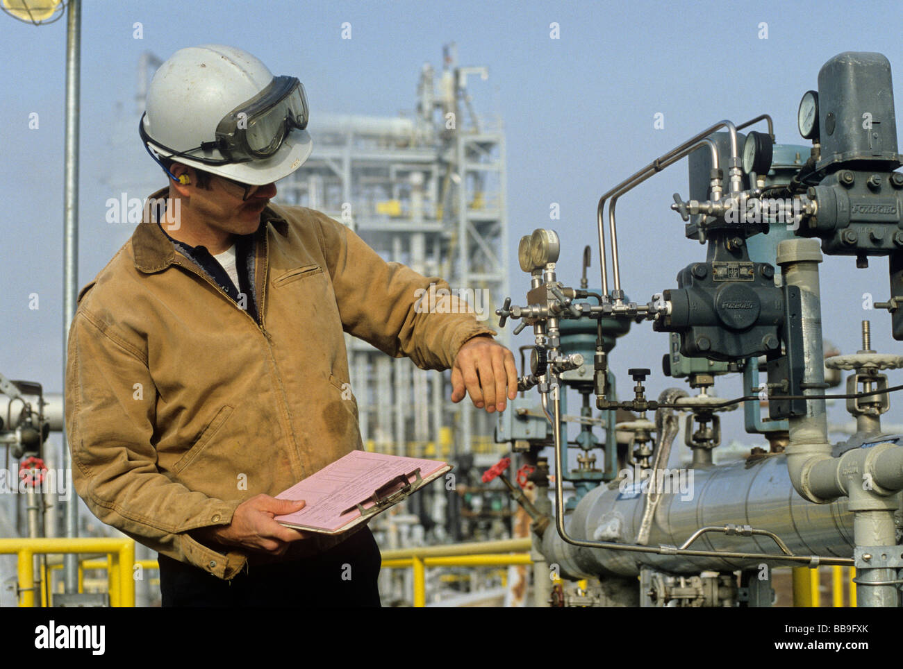 engineer checking pressure gauges at chemical plant Stock Photo - Alamy