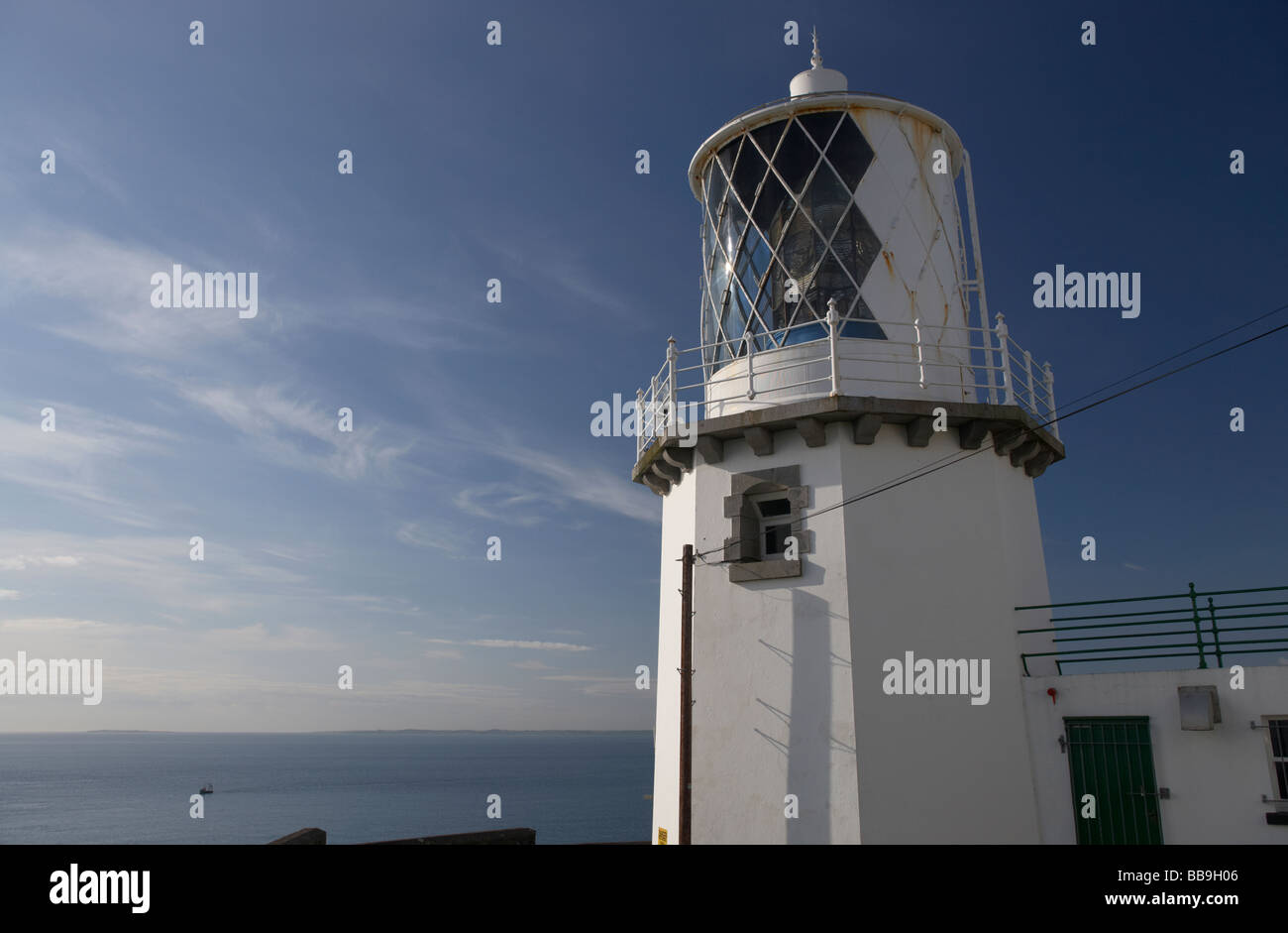 blackhead whitehead lighthouse on cliff face overlooking the sea with ...