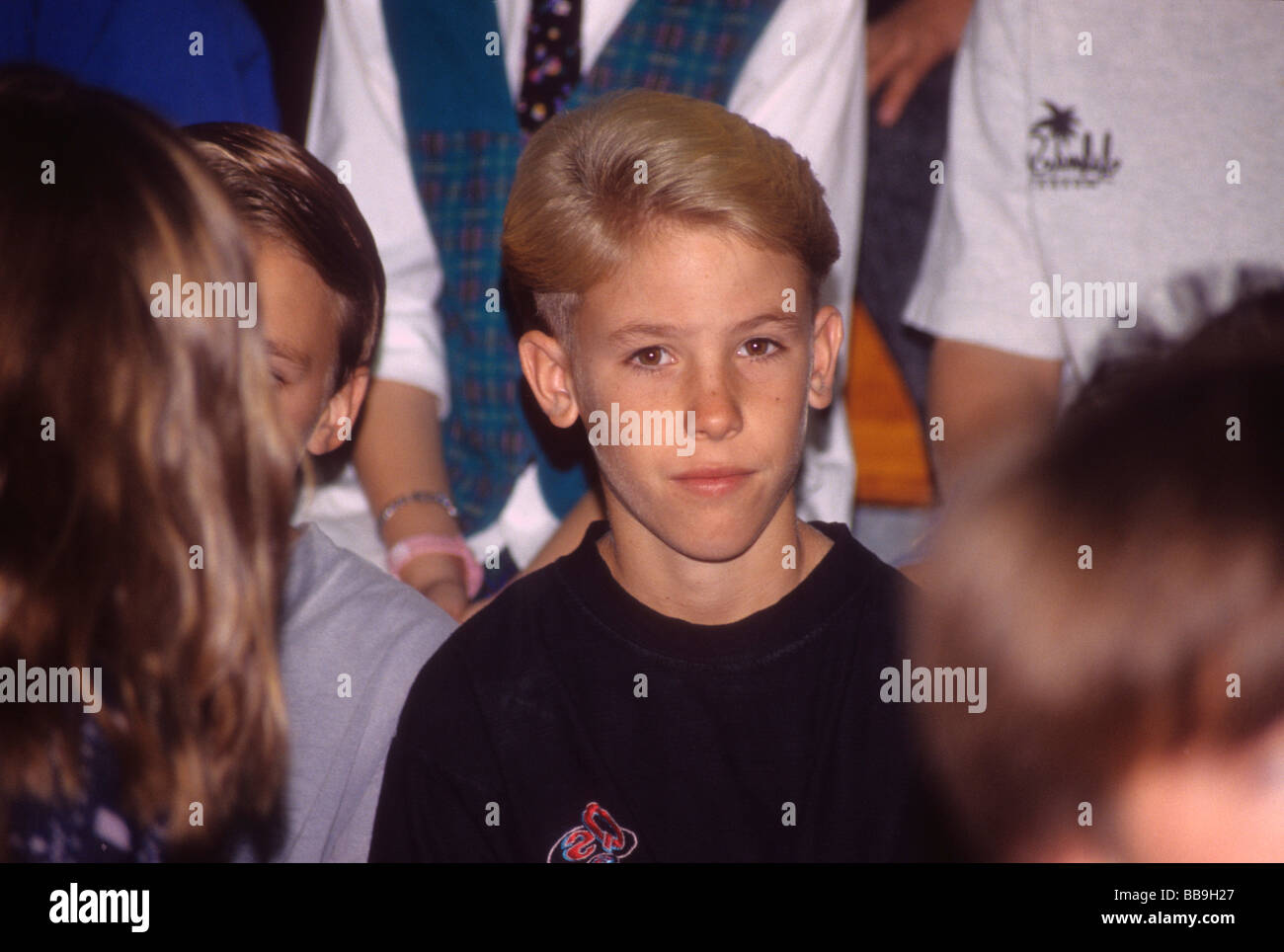 Boy group student smile alert listen friend blond face happy Stock ...