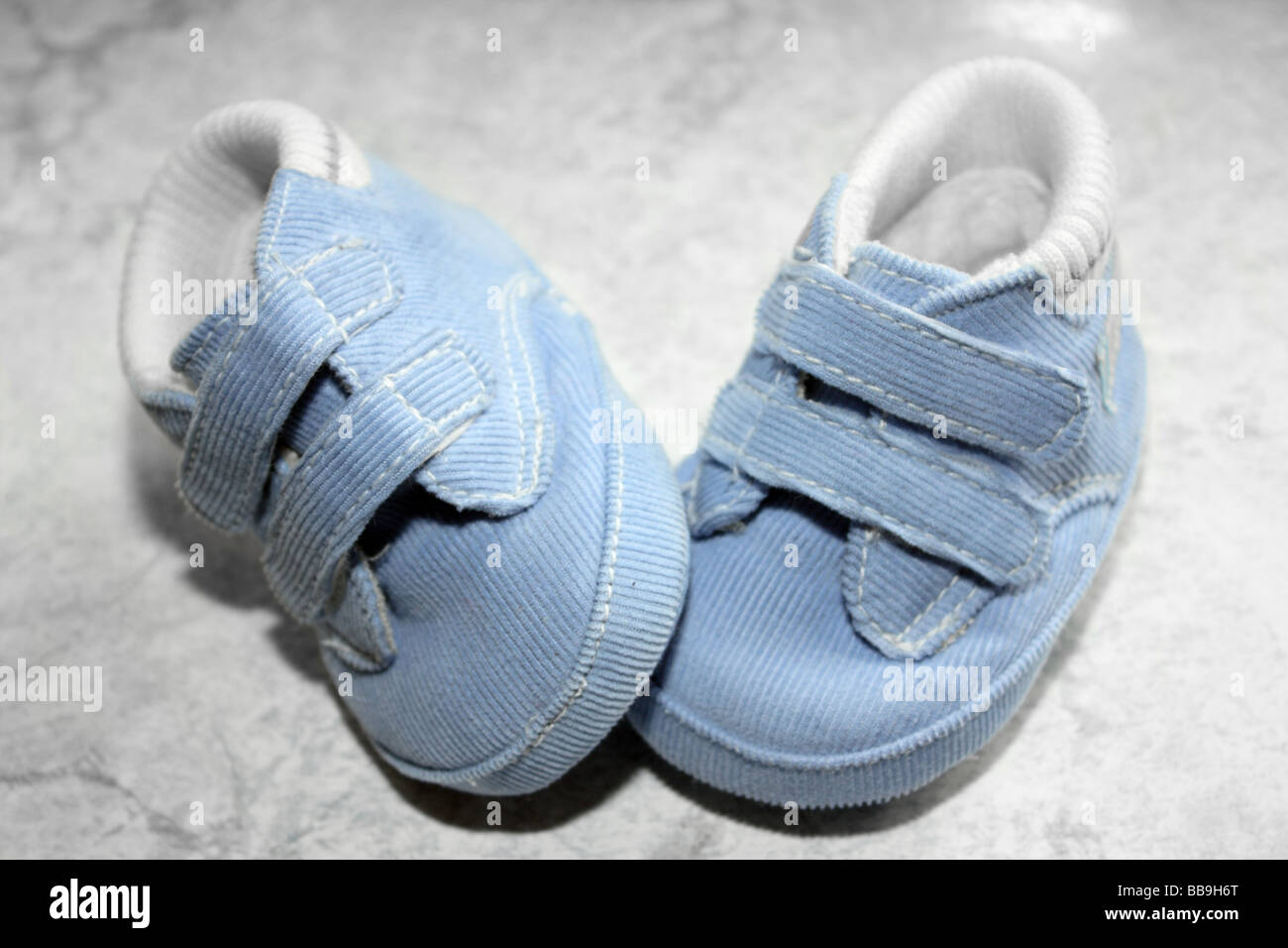 A pair of baby blue booties for a newborn baby boy Stock Photo - Alamy