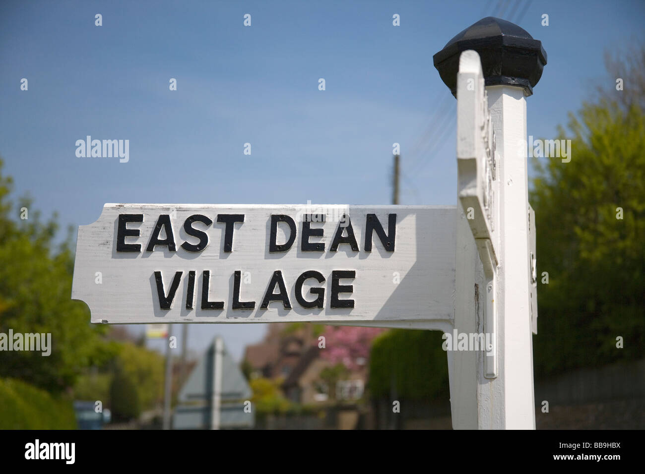 direction sign for east dean village Stock Photo - Alamy