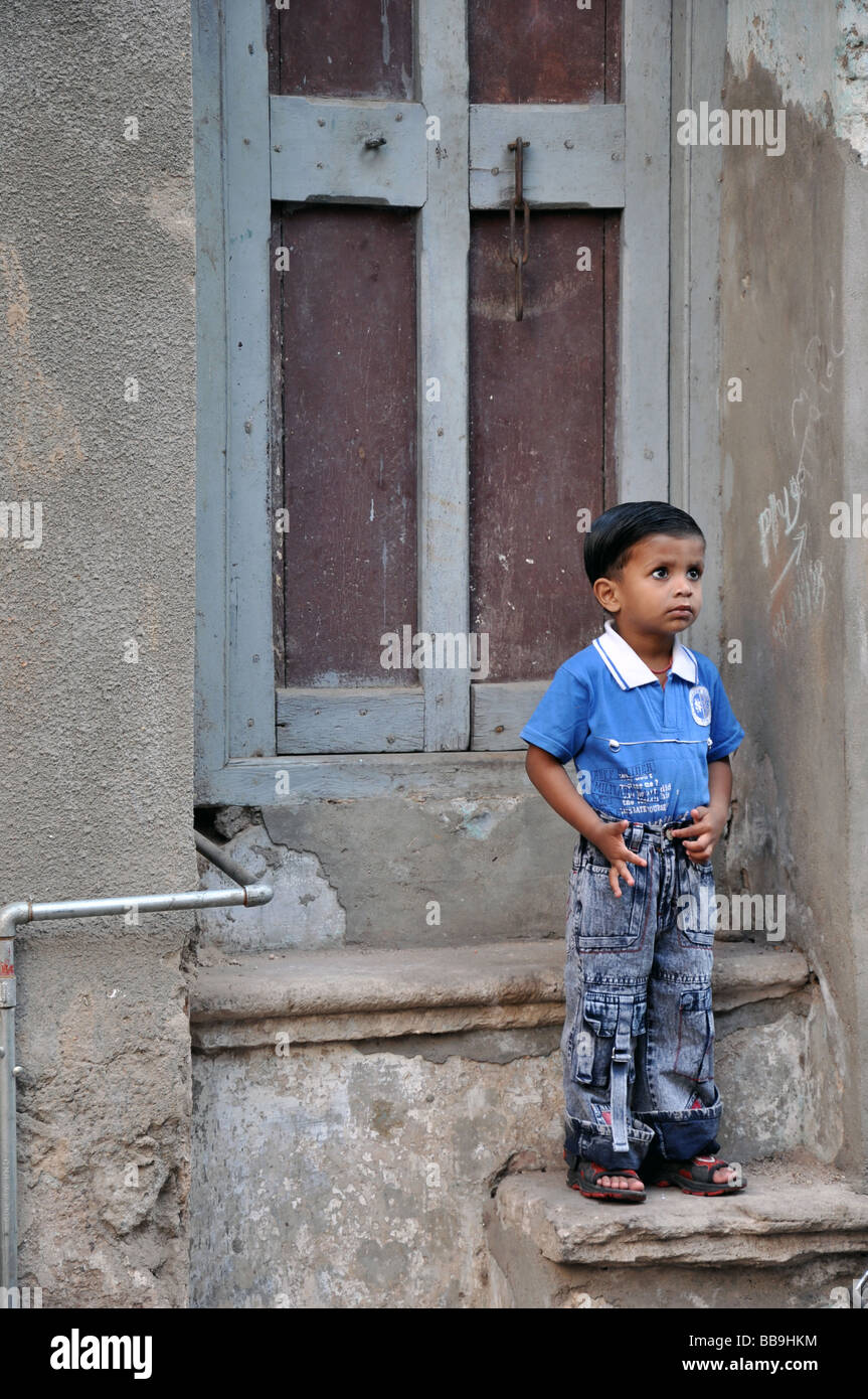 A lone and very serious child on the street in Poshina, Gujarat, India ...