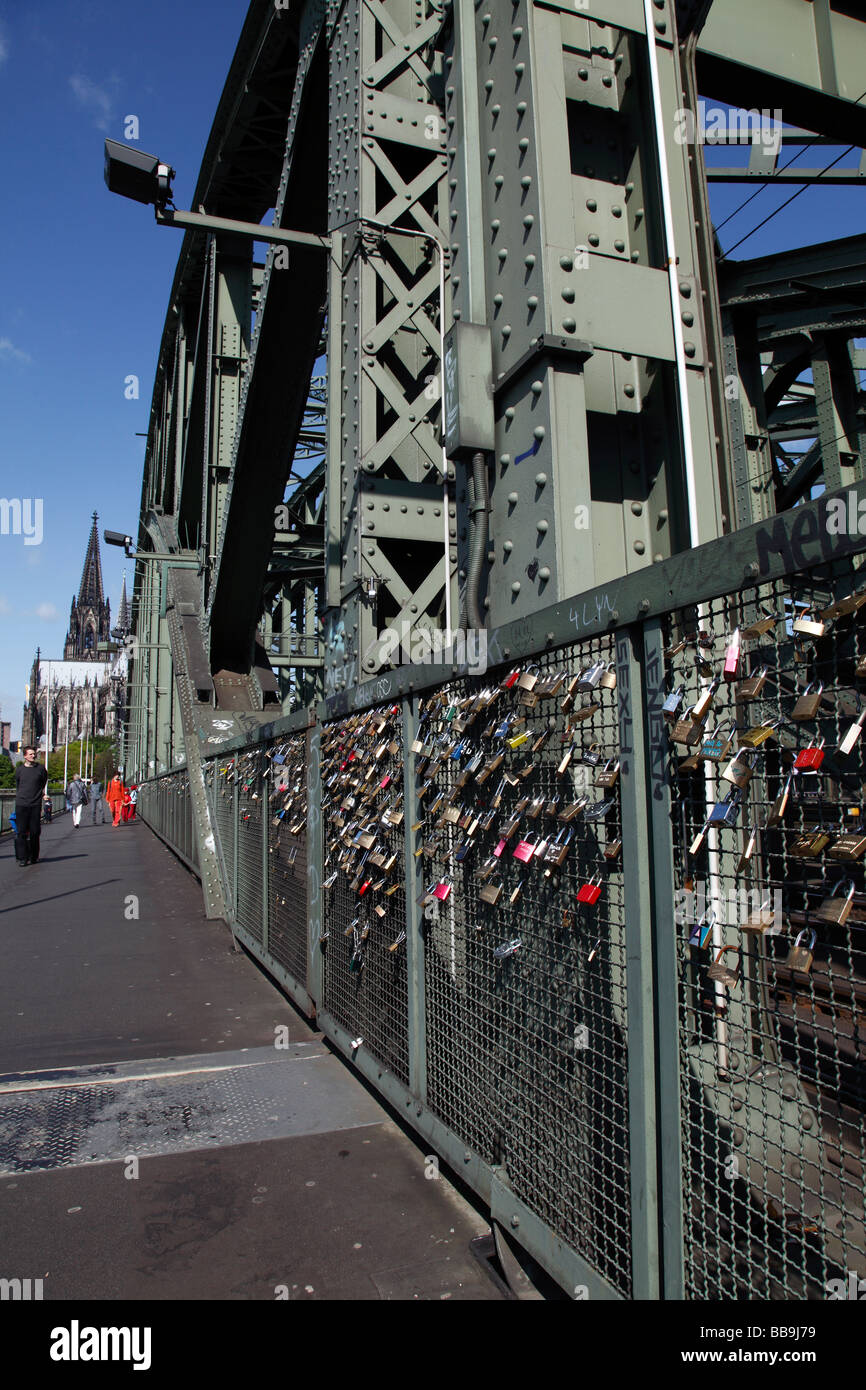 Padlocks attached to the Hohenzollern bridge over the Rhine river in ...