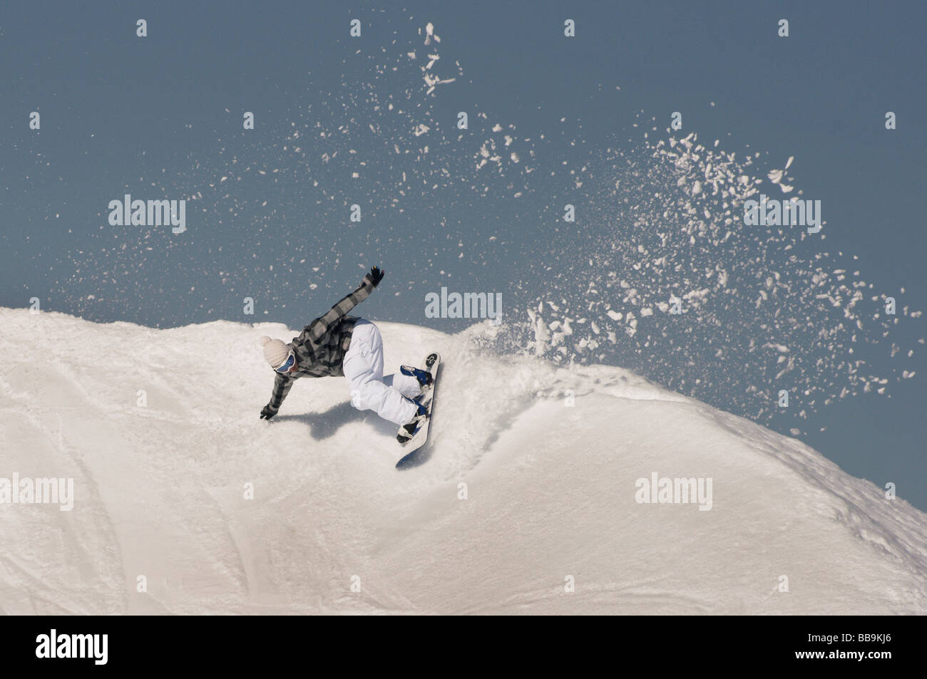 Winter Sports;Snow Boarding;Male kicking up snow in a tight turn Stock ...